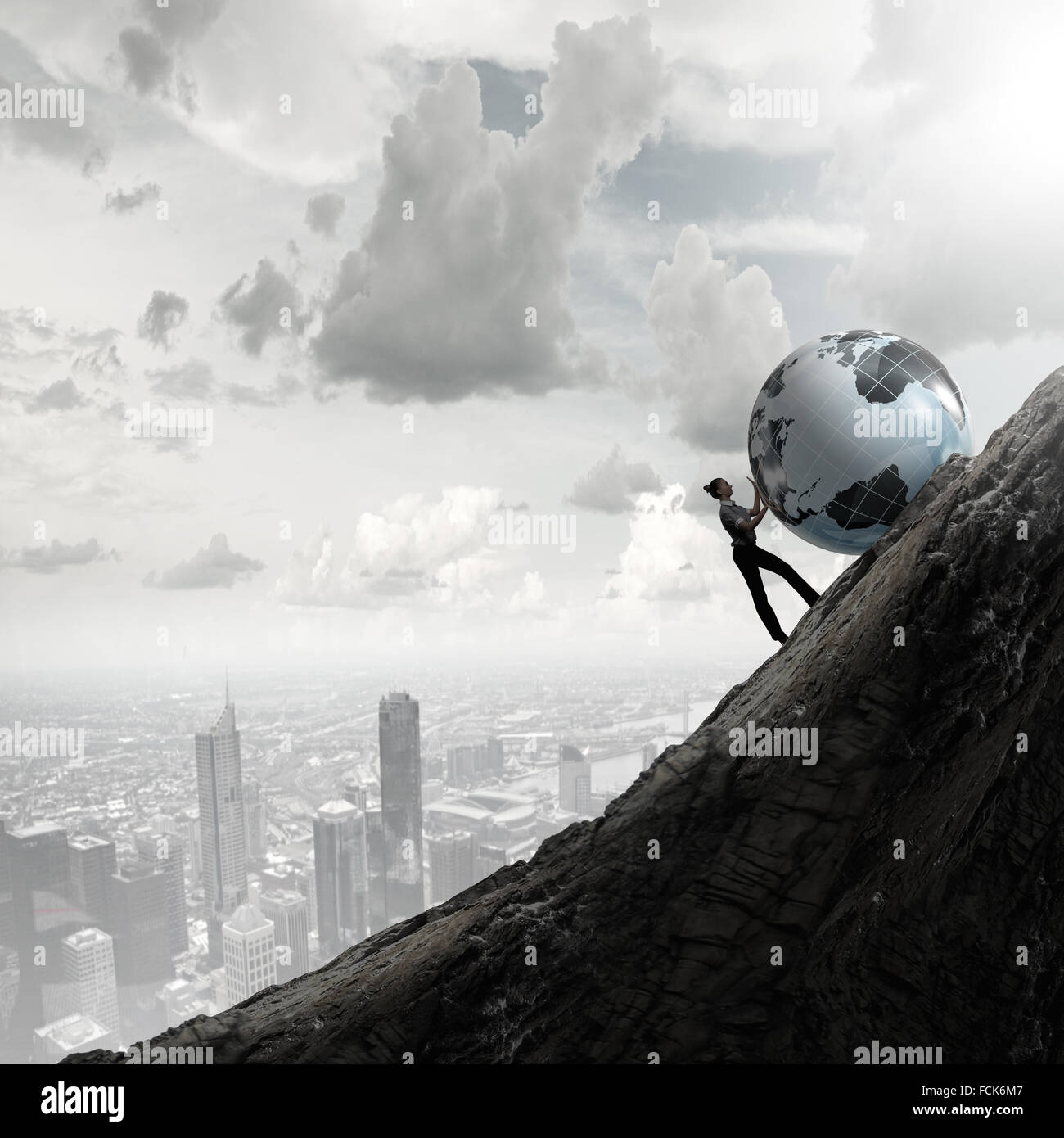 Young businesswoman rolling Earth planet up th hill Stock Photo - Alamy