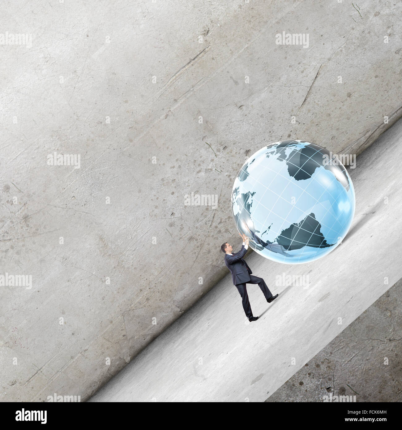 Young businessman rolling Earth planet up th hill Stock Photo - Alamy