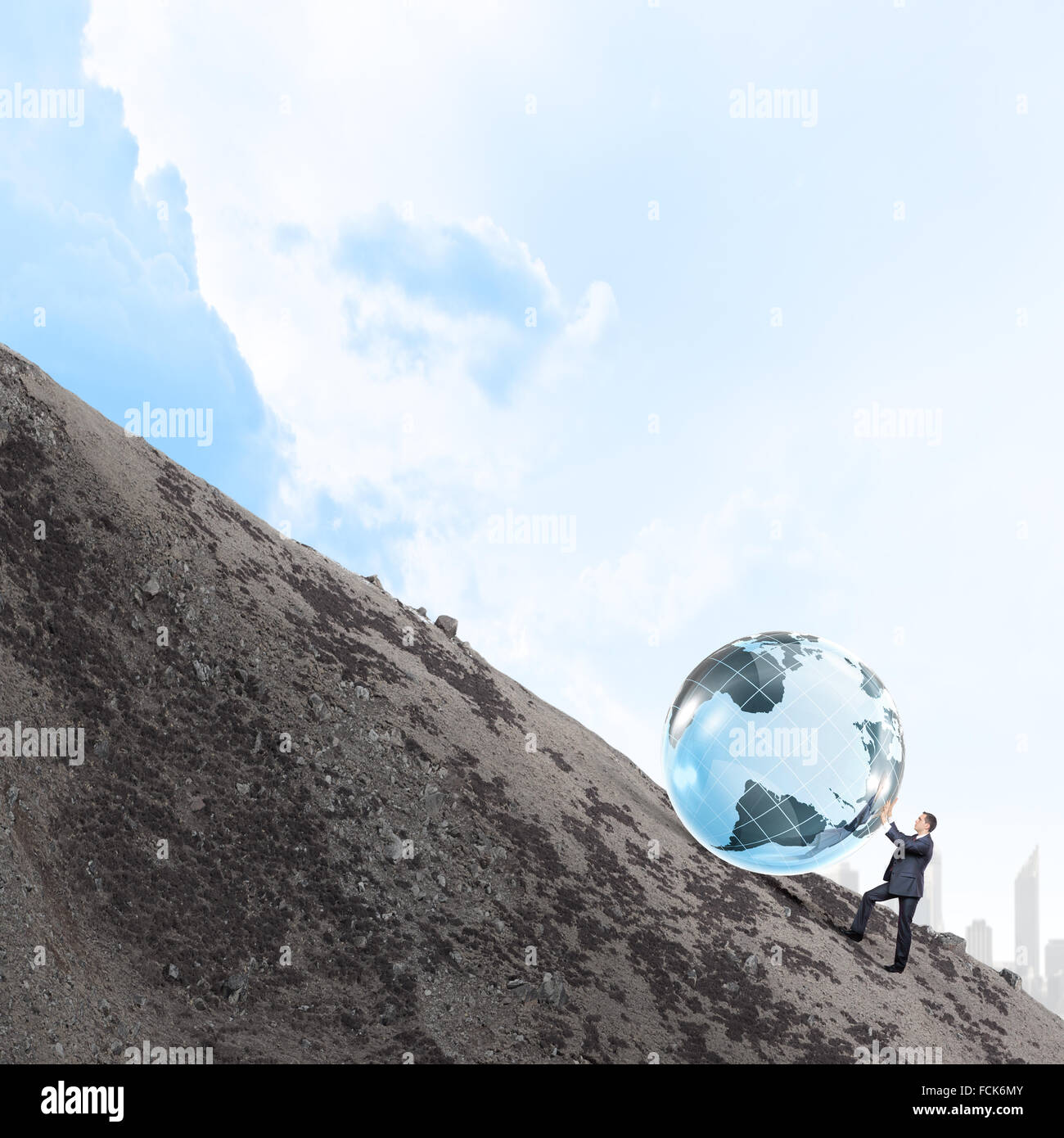 Young businessman rolling Earth planet up th hill Stock Photo - Alamy