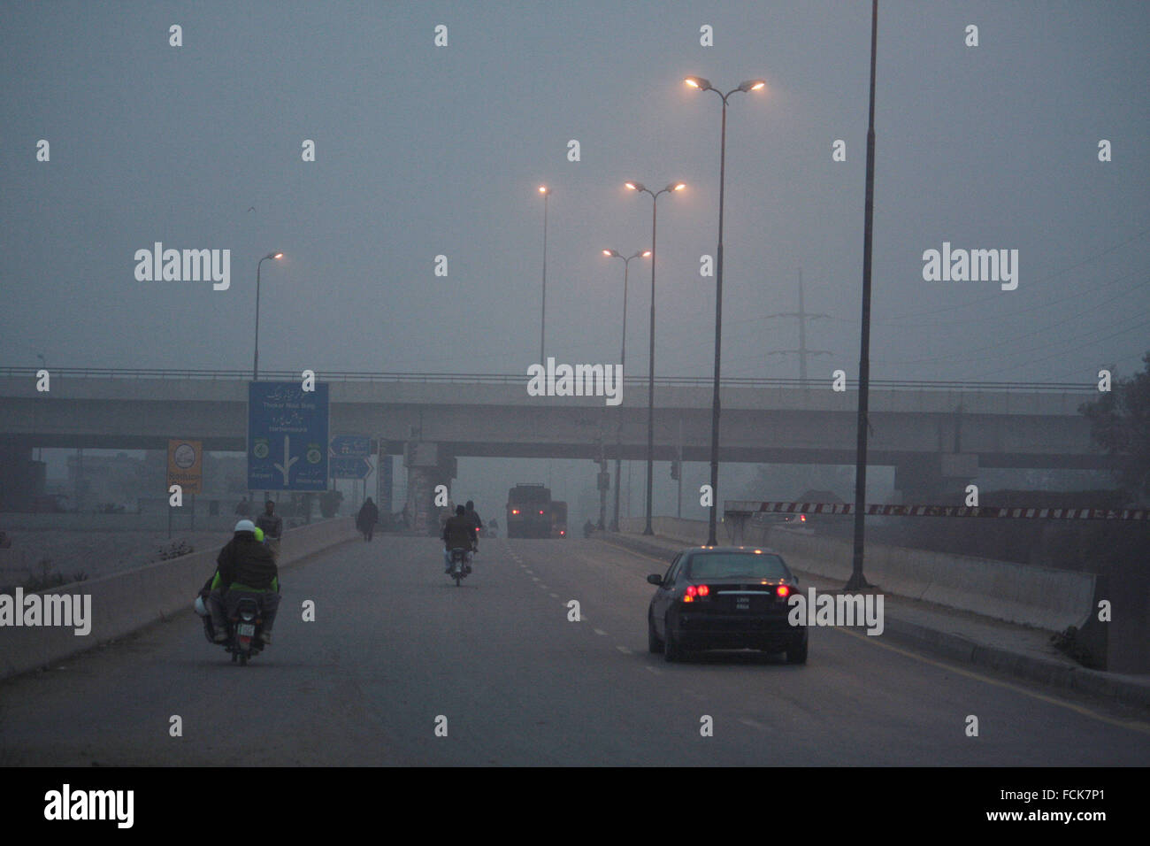 Lahore. 23rd Jan, 2016. Vehicles run in dense fog in east Pakistan's ...