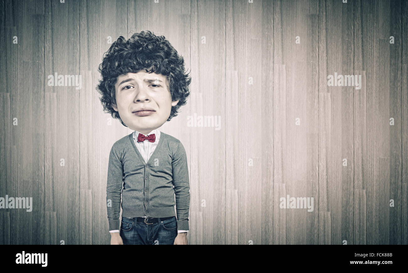 Funny crying young man with big head Stock Photo - Alamy
