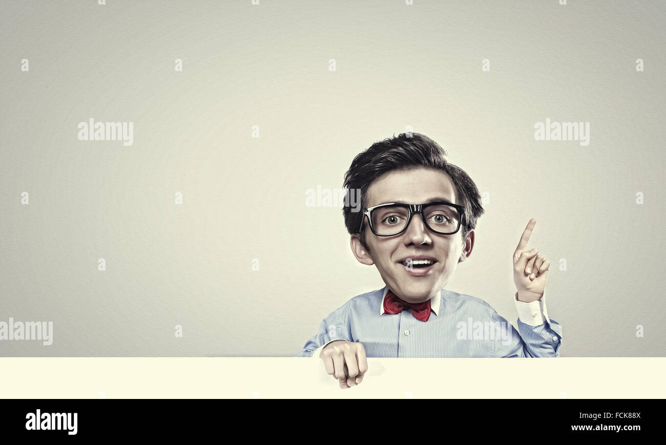Young funny man with big head holding banner Stock Photo - Alamy