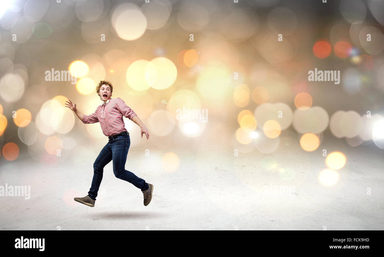 Man run away jeans hi-res stock photography and images - Alamy