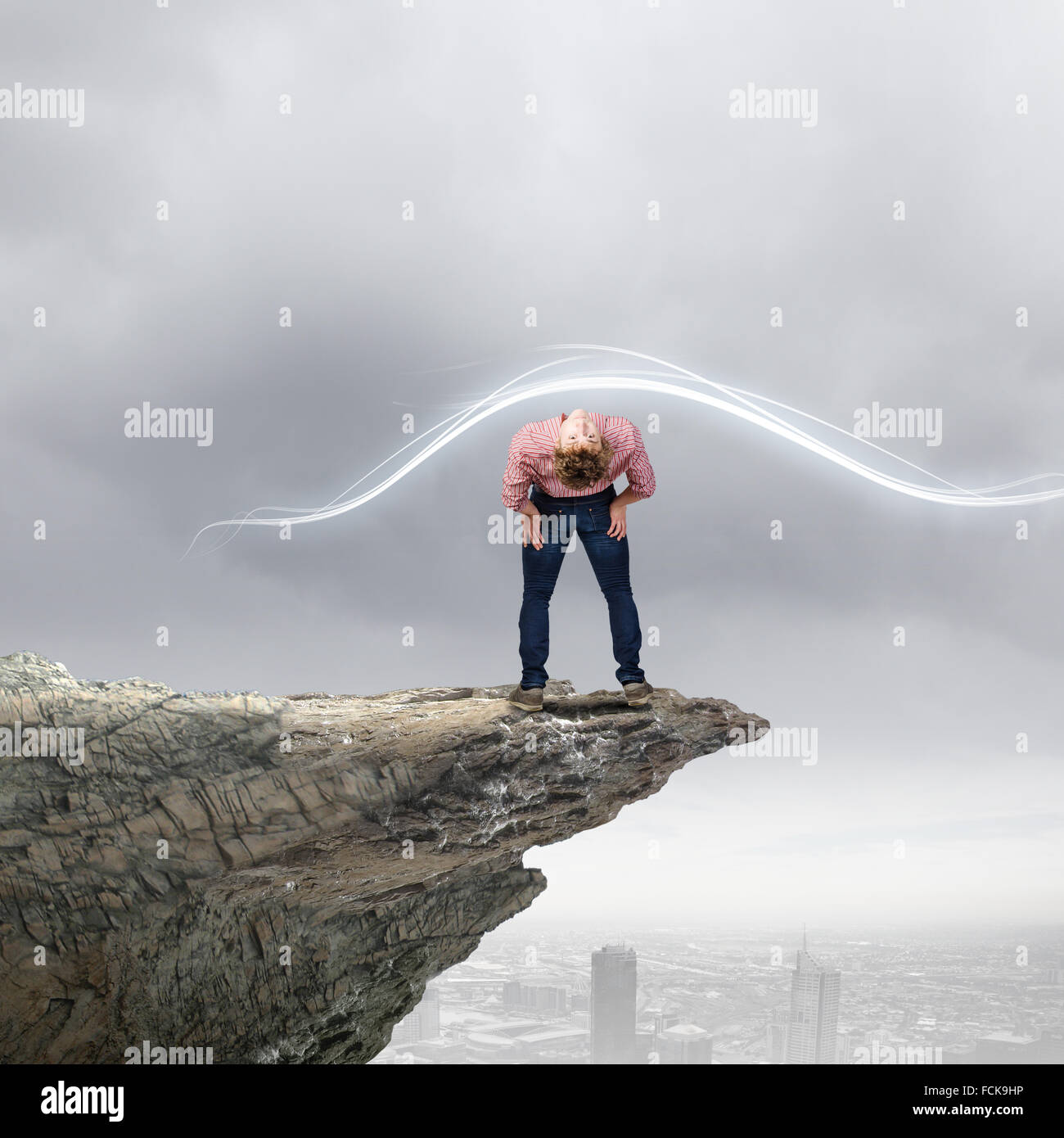 Young guy in casual evading from light rays Stock Photo - Alamy
