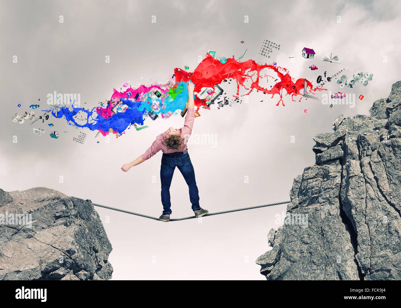 Young guy in casual evading from colorful paint splashes Stock Photo ...