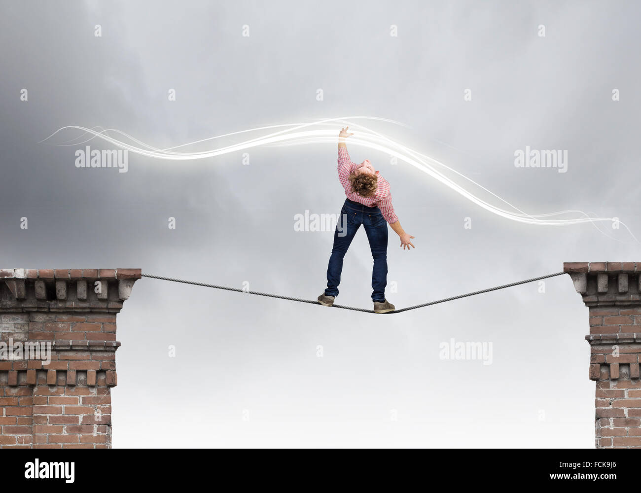 Young guy in casual evading from light rays Stock Photo - Alamy