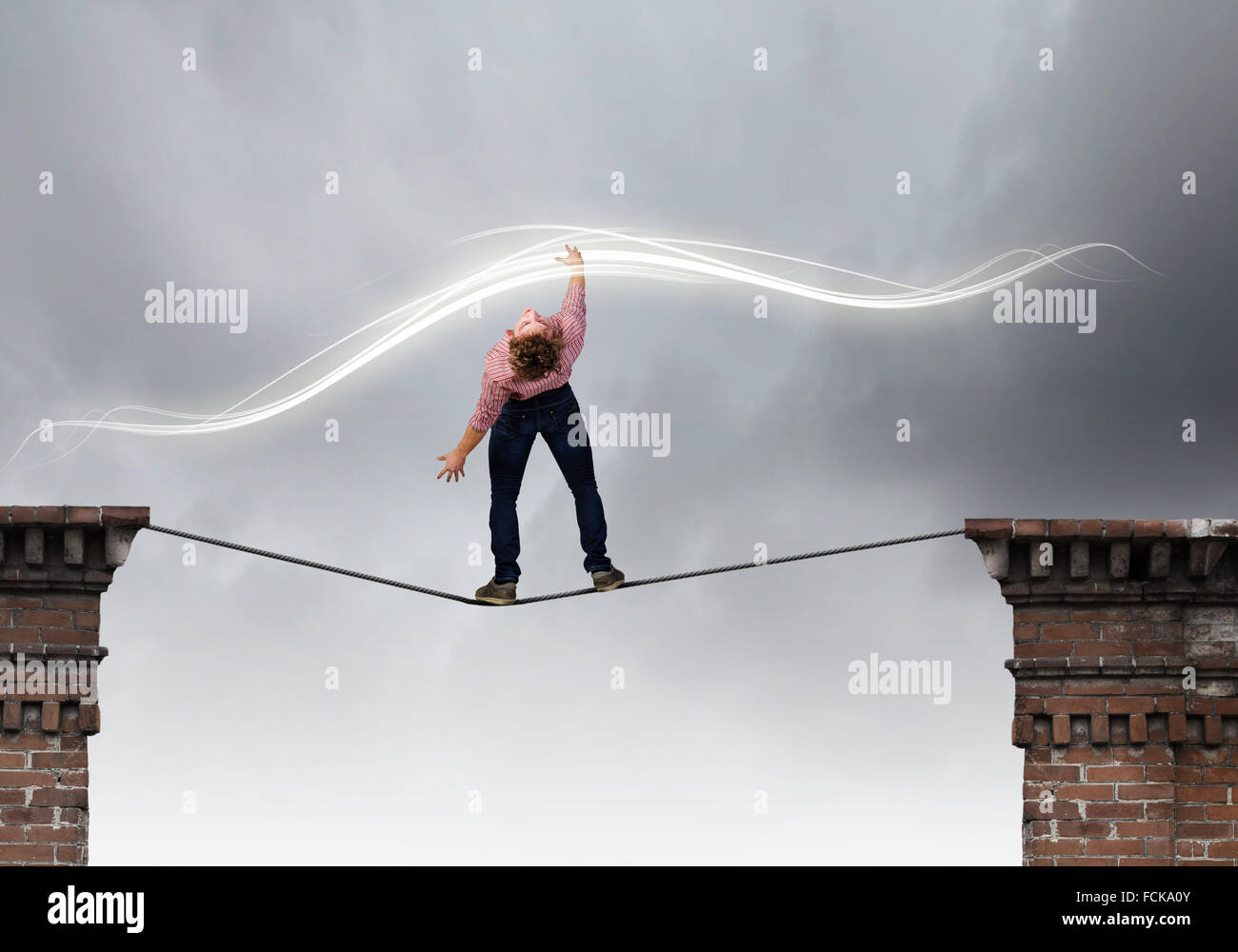 Young guy in casual evading from light rays Stock Photo - Alamy