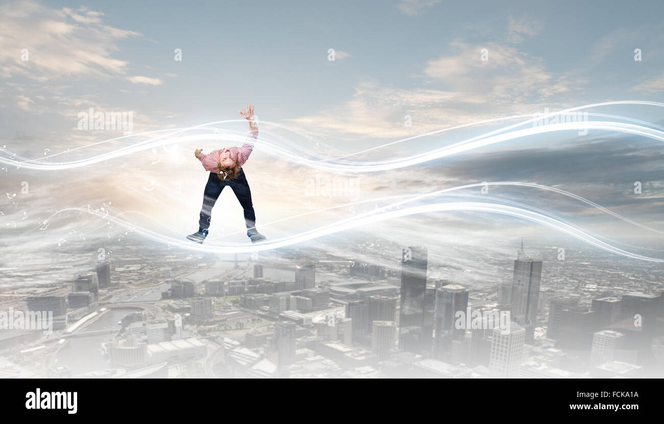 Young guy in casual evading from light rays Stock Photo - Alamy