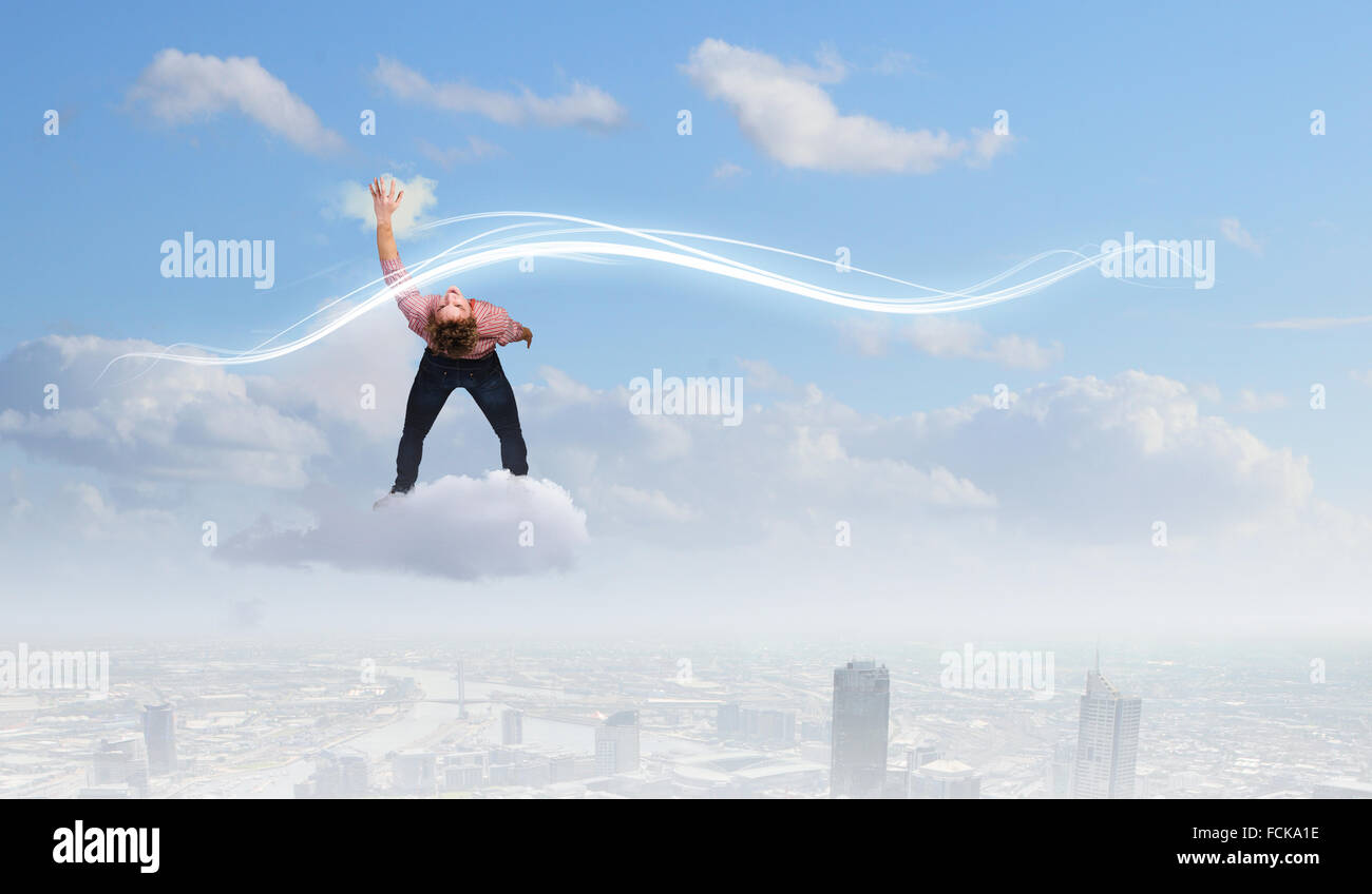 Young guy in casual evading from light rays Stock Photo - Alamy