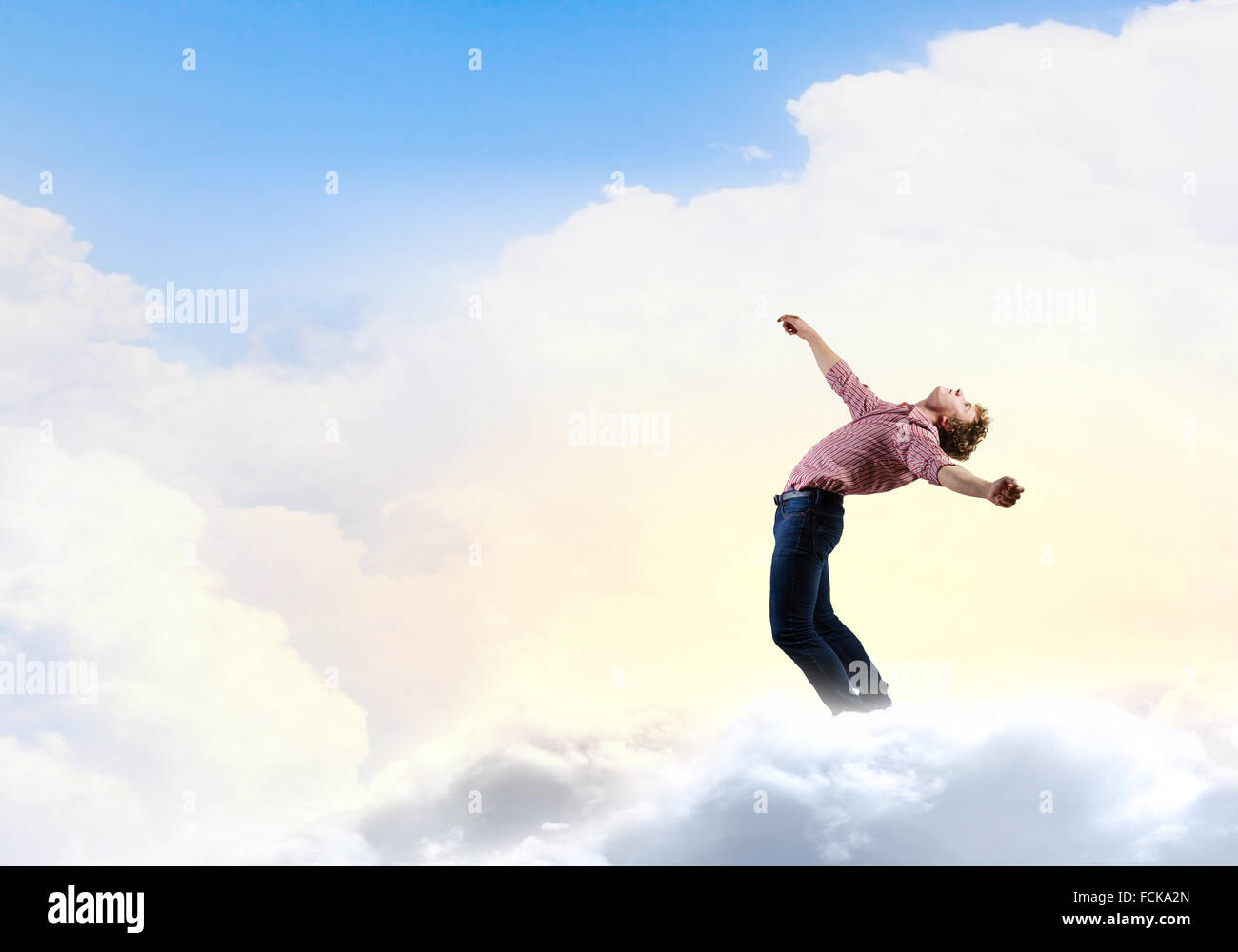 Young guy in casual evading from light rays Stock Photo - Alamy
