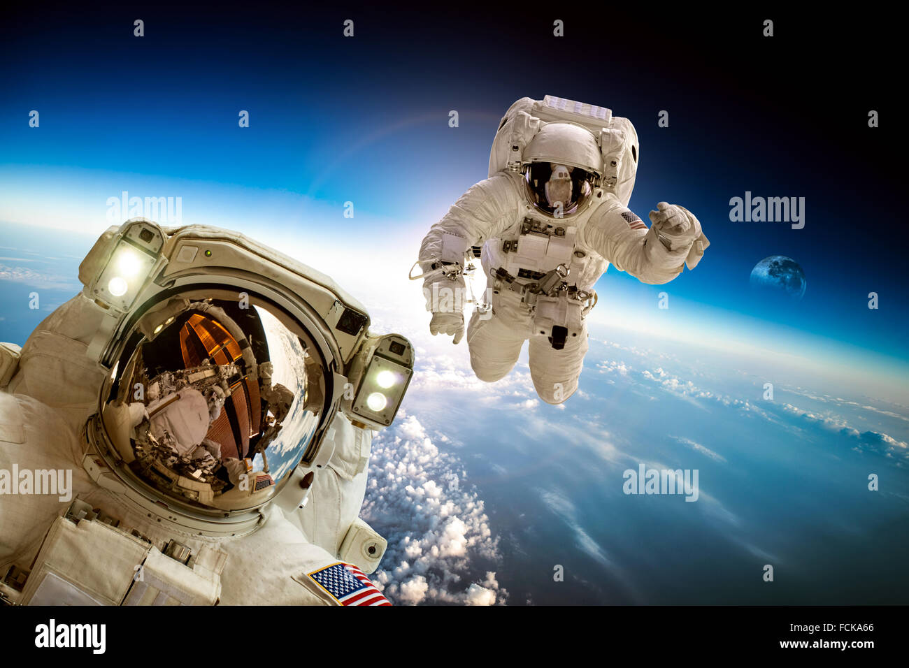 Astronaut in outer space against the backdrop of the planet earth ...
