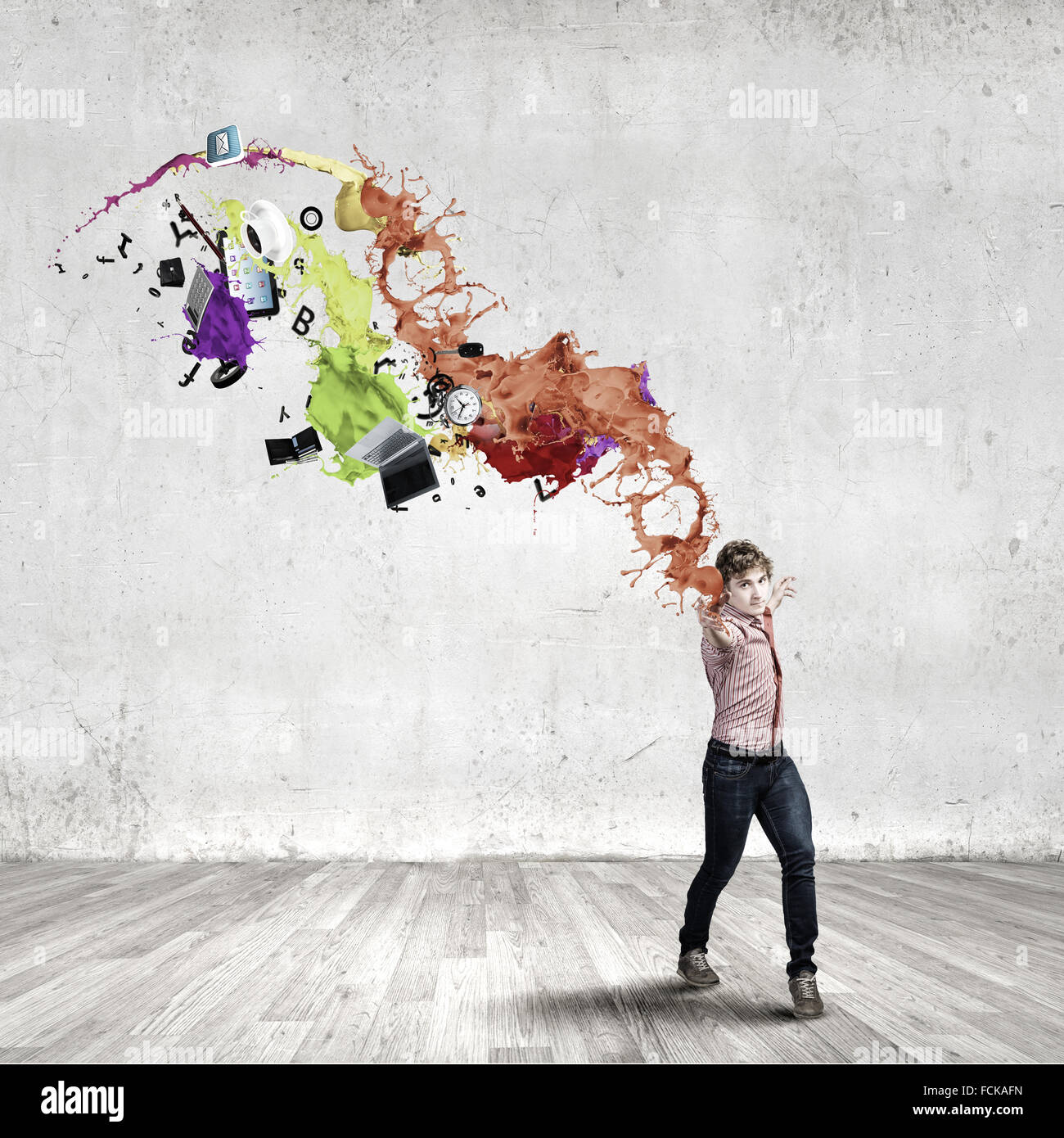 Young man in casual throwing colorful paint splashes Stock Photo - Alamy