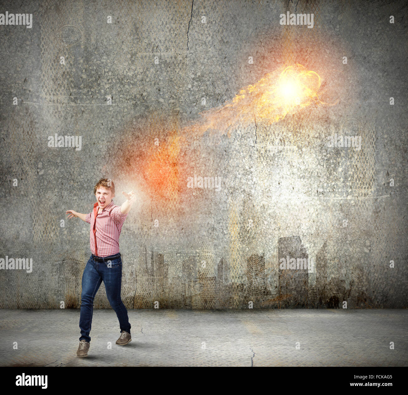 Young man in casual throwing magic fire balls Stock Photo - Alamy