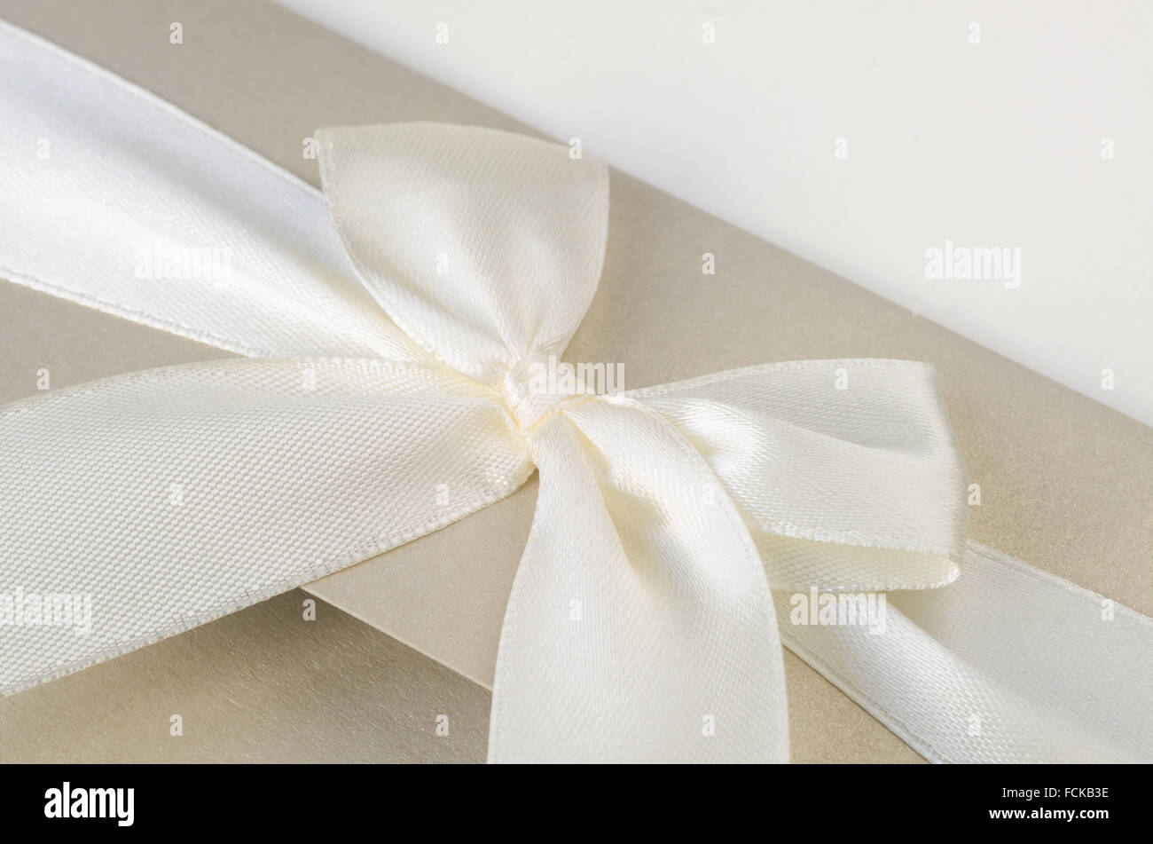 closeup to white ribbon on paper Stock Photo - Alamy