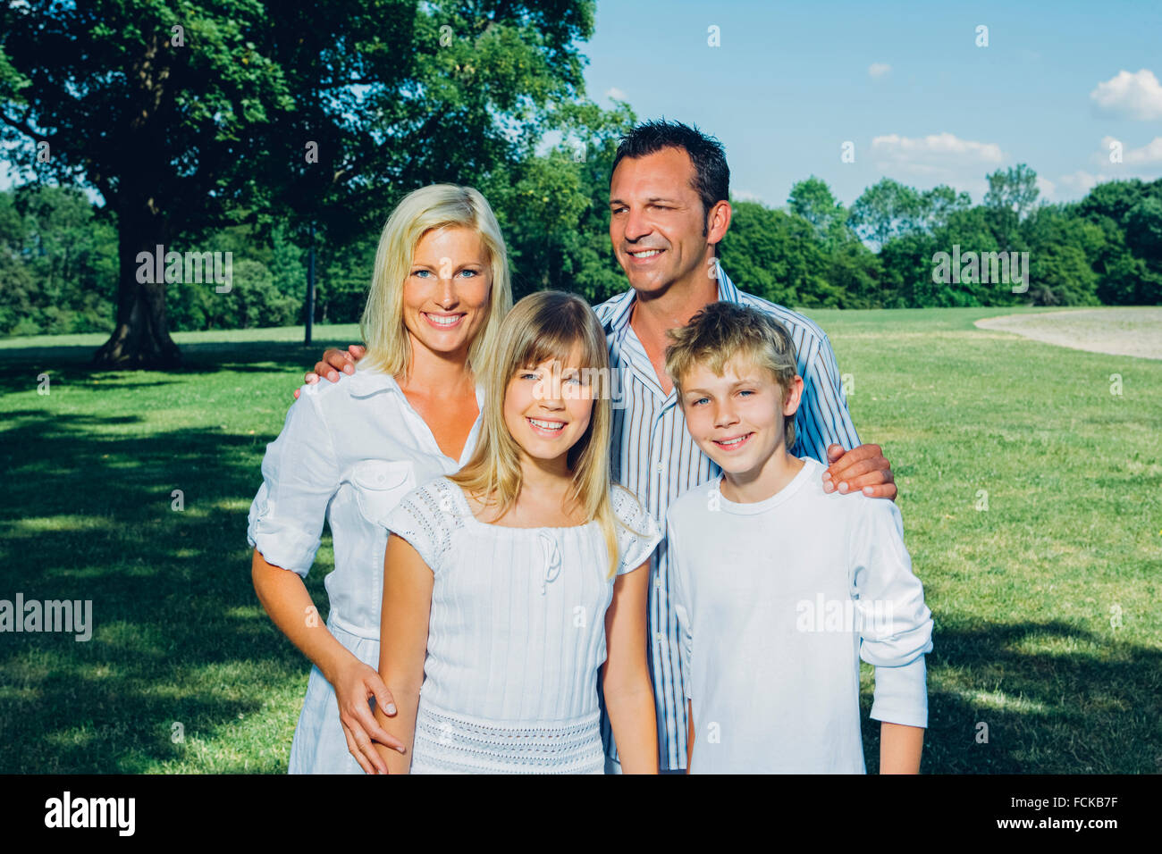 Family portrait in a park Stock Photo - Alamy