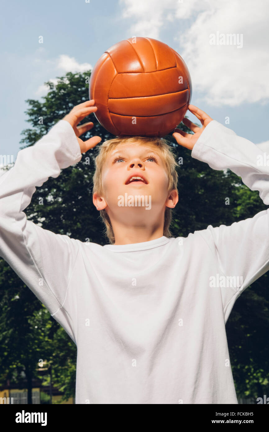 Boy balancing on head hi-res stock photography and images - Alamy