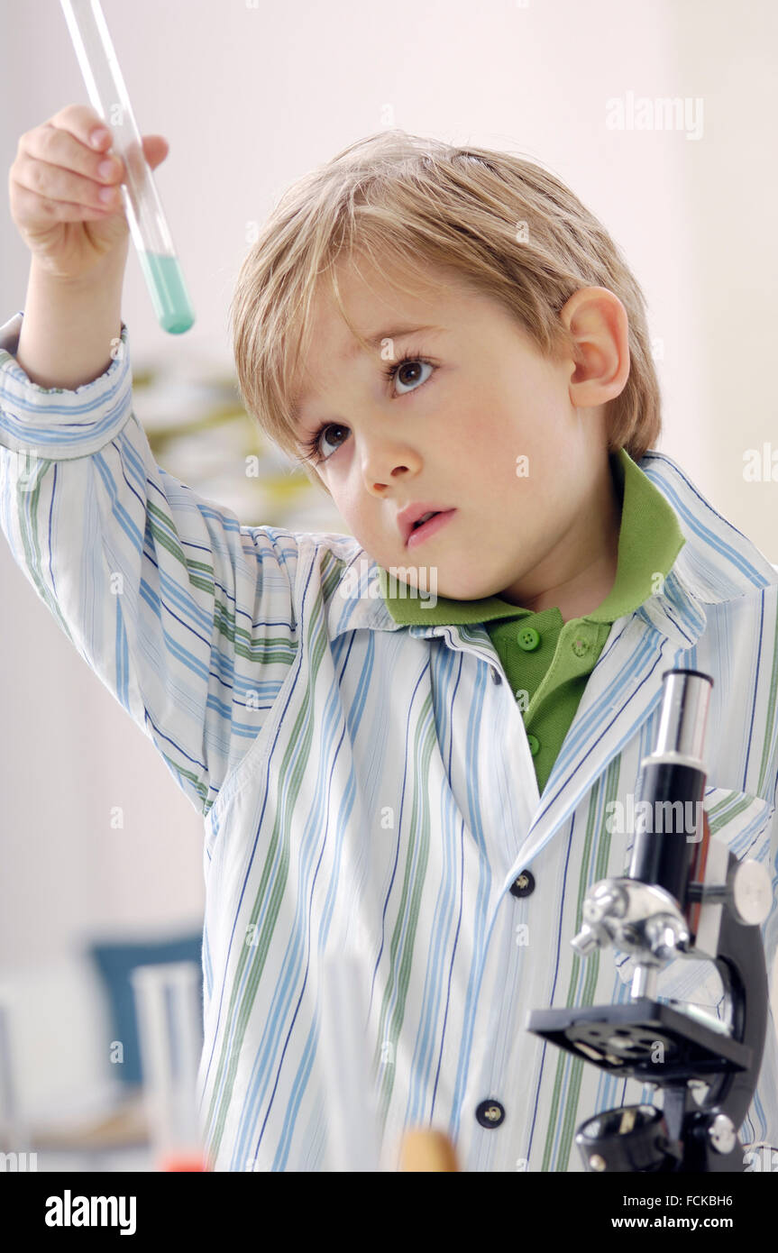 Portrait of little boy test tube and microscope Stock Photo - Alamy