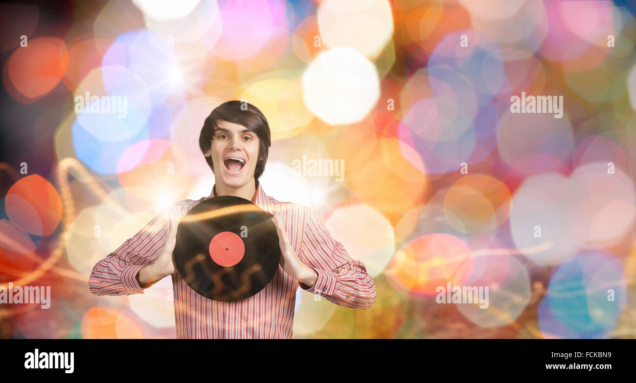 Young handsome man dj holding disco plate Stock Photo - Alamy