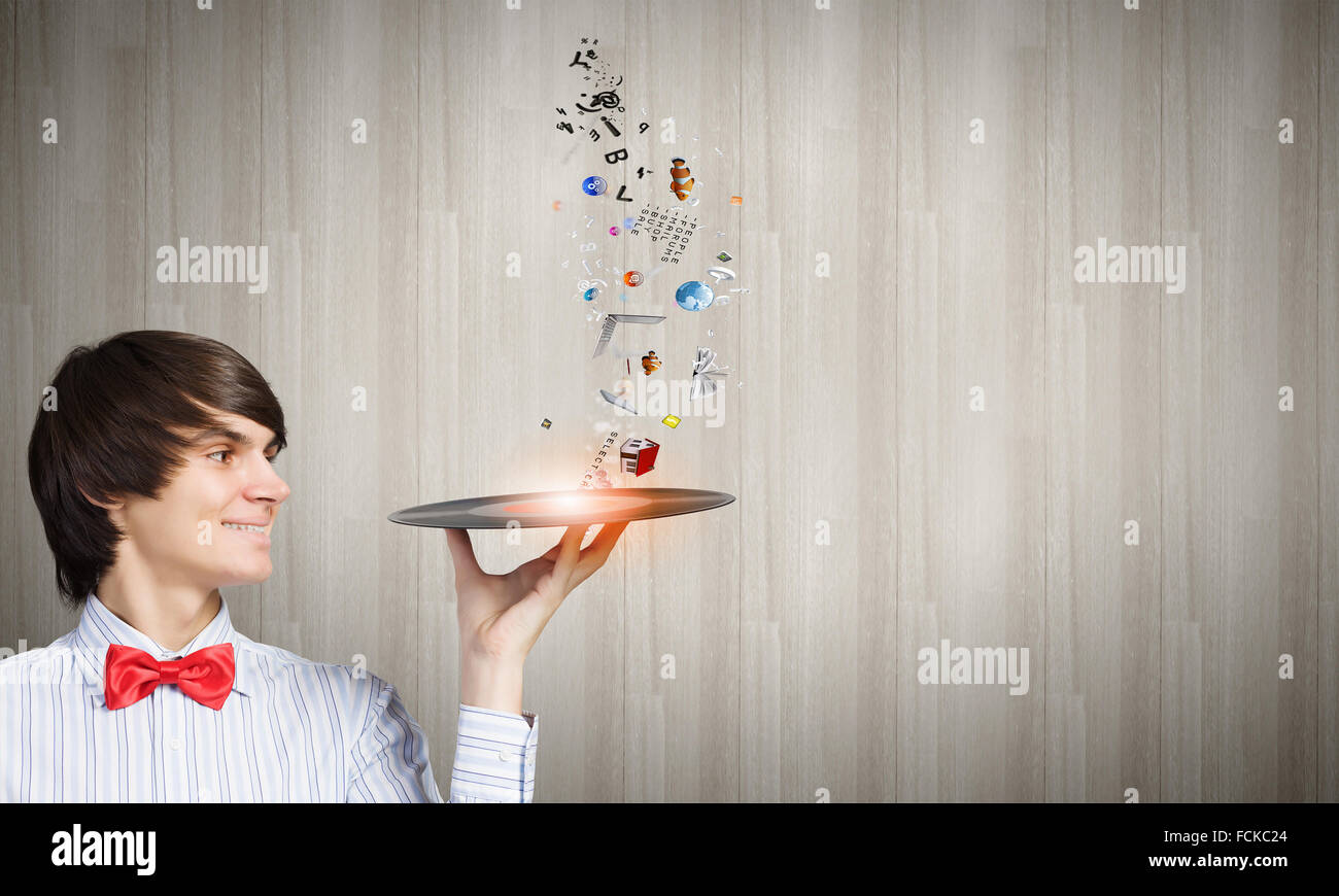 Young handsome man dj holding disco plate Stock Photo - Alamy