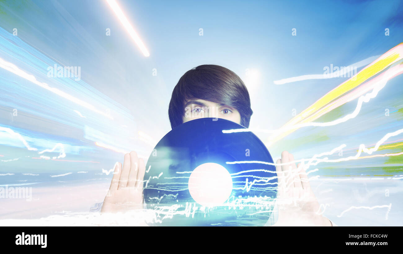 Young handsome man dj holding disco plate Stock Photo - Alamy