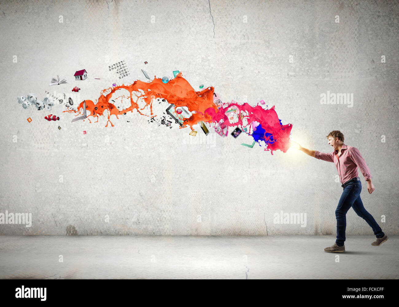 Young man in casual throwing colorful paint splashes Stock Photo - Alamy