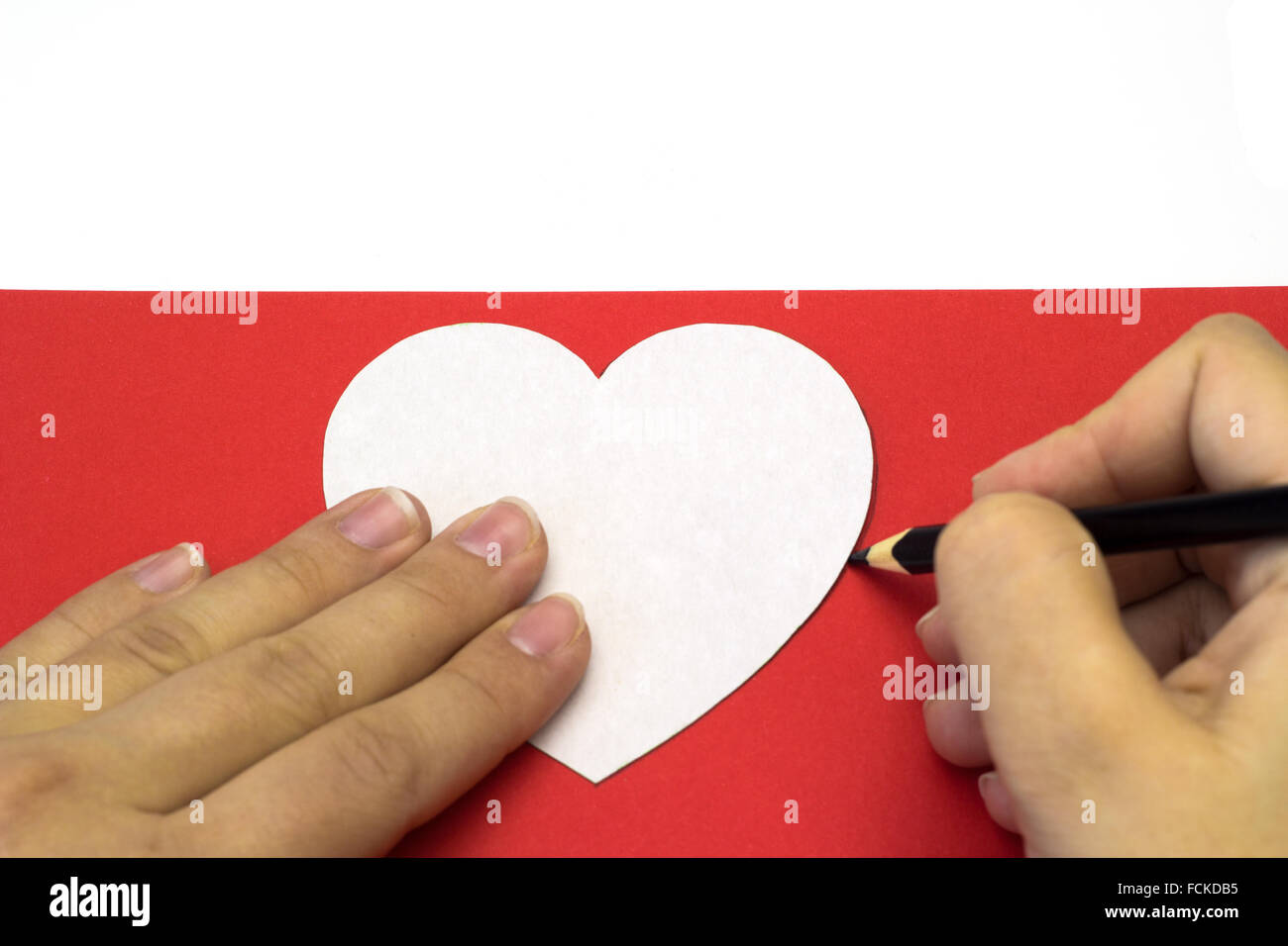 Creating red heart of colored paper pattern Stock Photo - Alamy