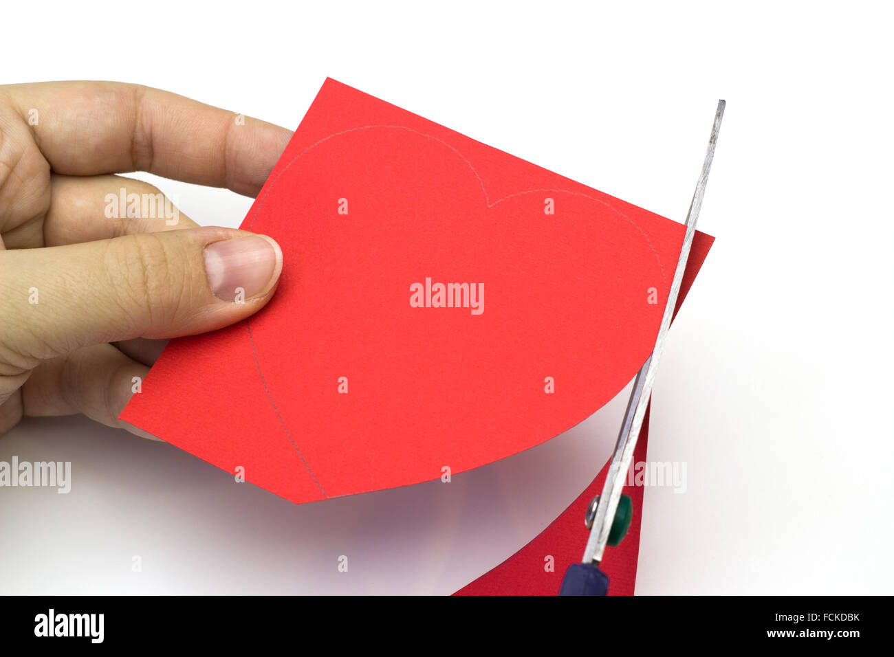 Creating red heart of colored paper pattern Stock Photo - Alamy