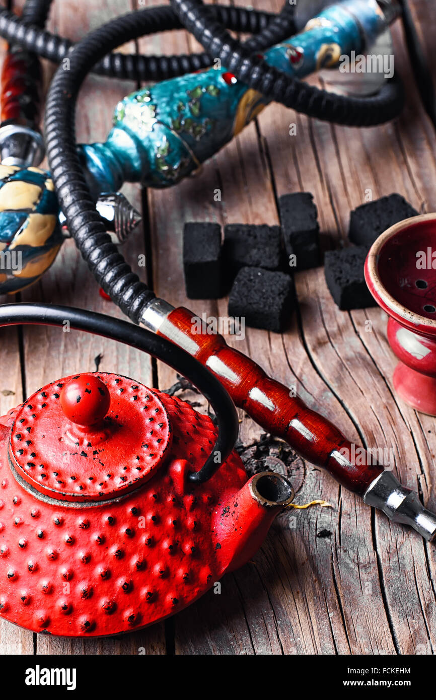 Details of Smoking hookah and red metal kettle spilled tea leaf Stock ...