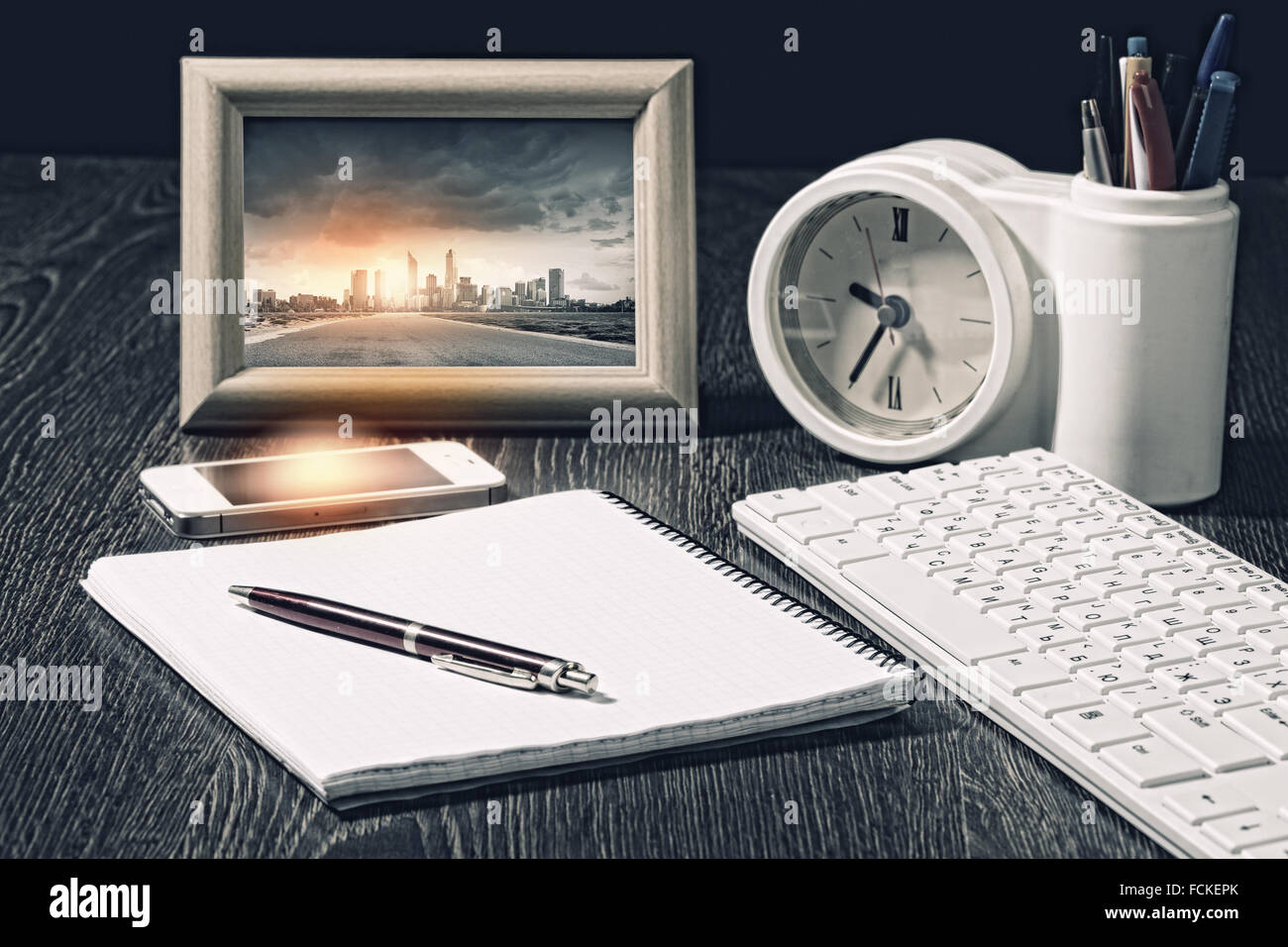 Close up of office workplace with notepad and keyboard Stock Photo - Alamy