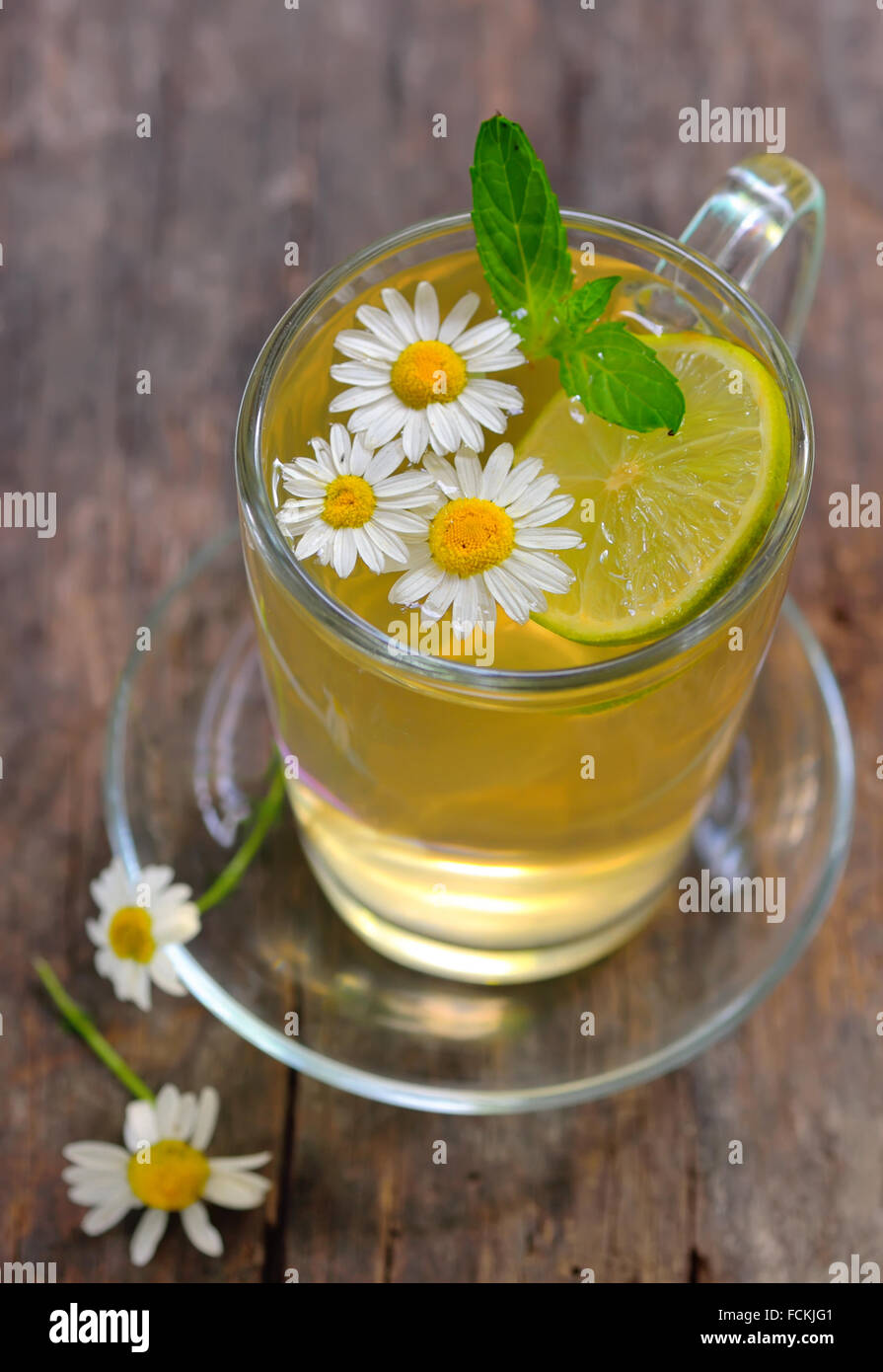 cup of chamomile tea with chamomile flowers Stock Photo - Alamy