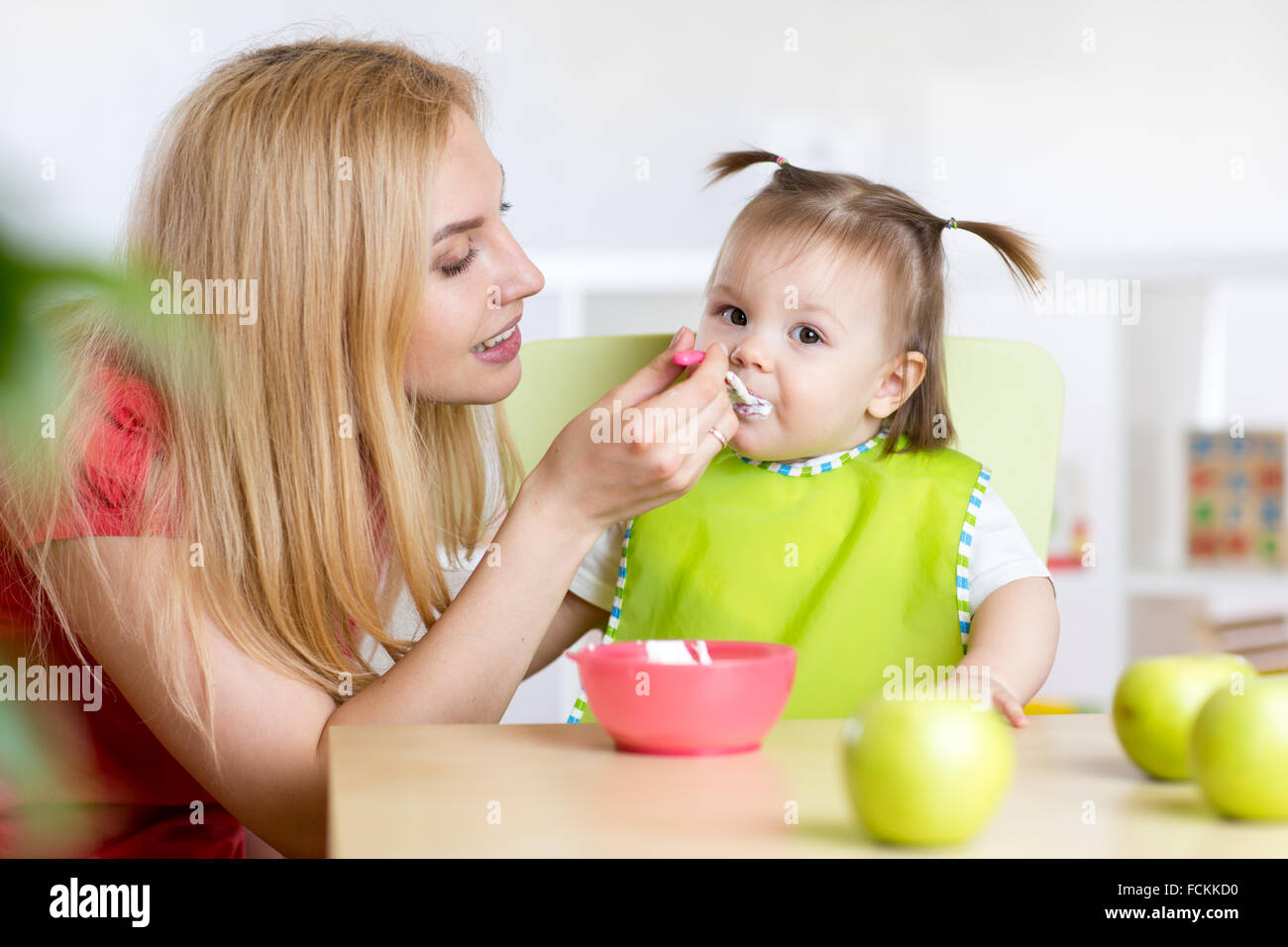 Mother Feeding Baby Stock Photo - Alamy