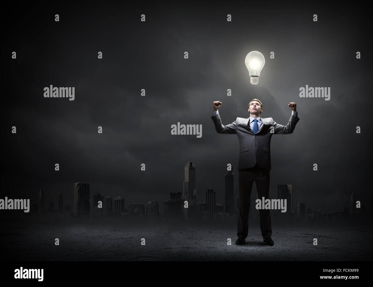 Young handsome businessman with hands up celebrating success Stock ...