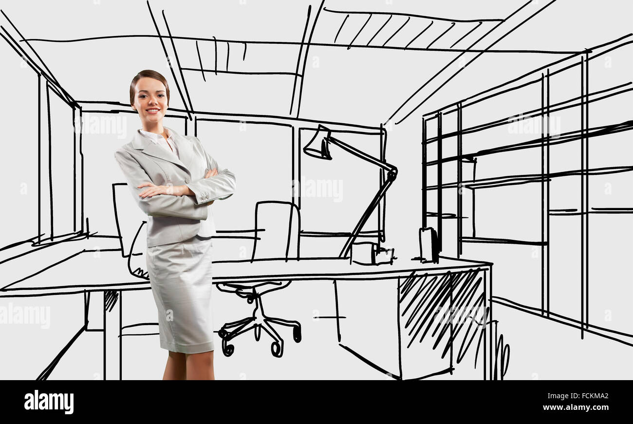 Young confident businesswoman standing in drawn office Stock Photo - Alamy