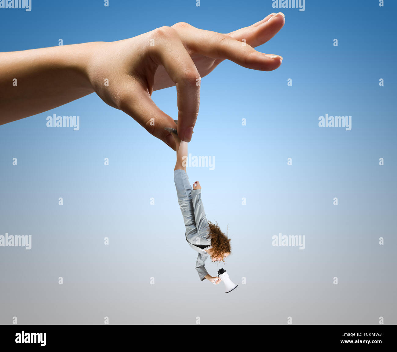 Giant human hand holding miniature of businesswoman Stock Photo - Alamy