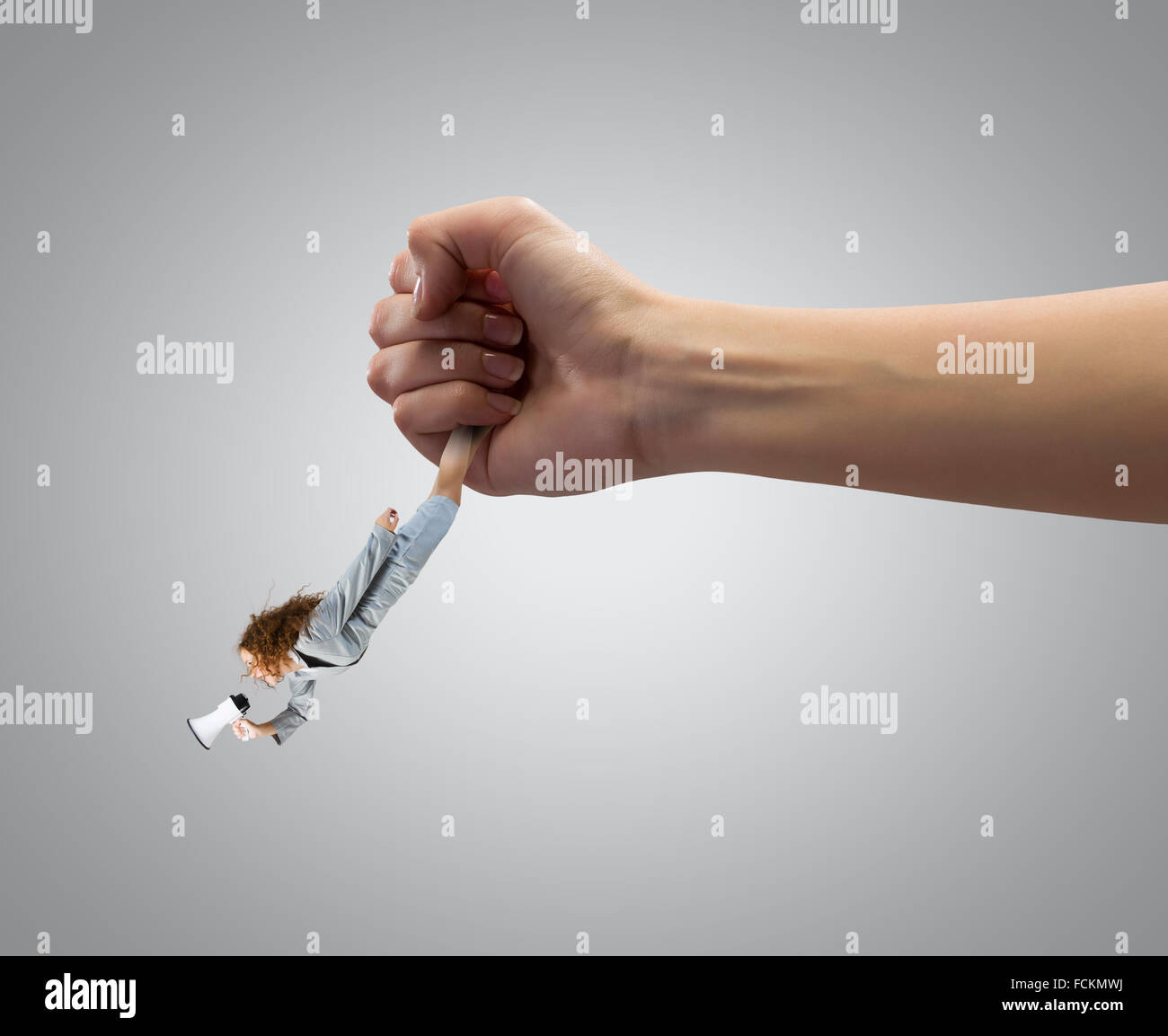 Giant human hand holding miniature of businesswoman Stock Photo - Alamy