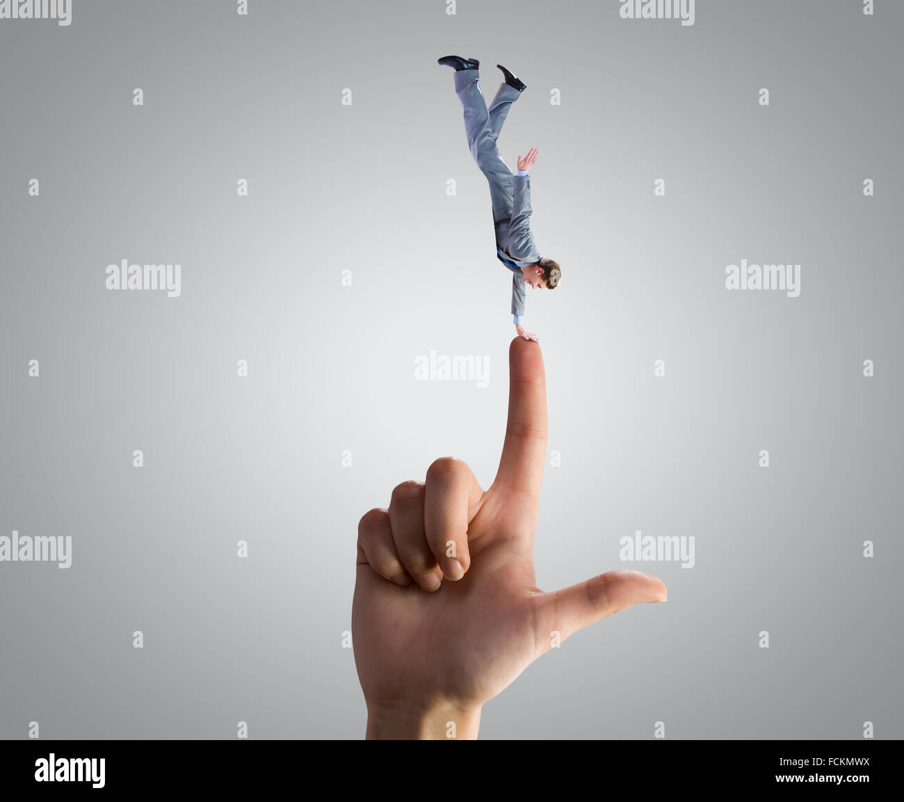 Close up of human hand holding miniature of businessman Stock Photo - Alamy