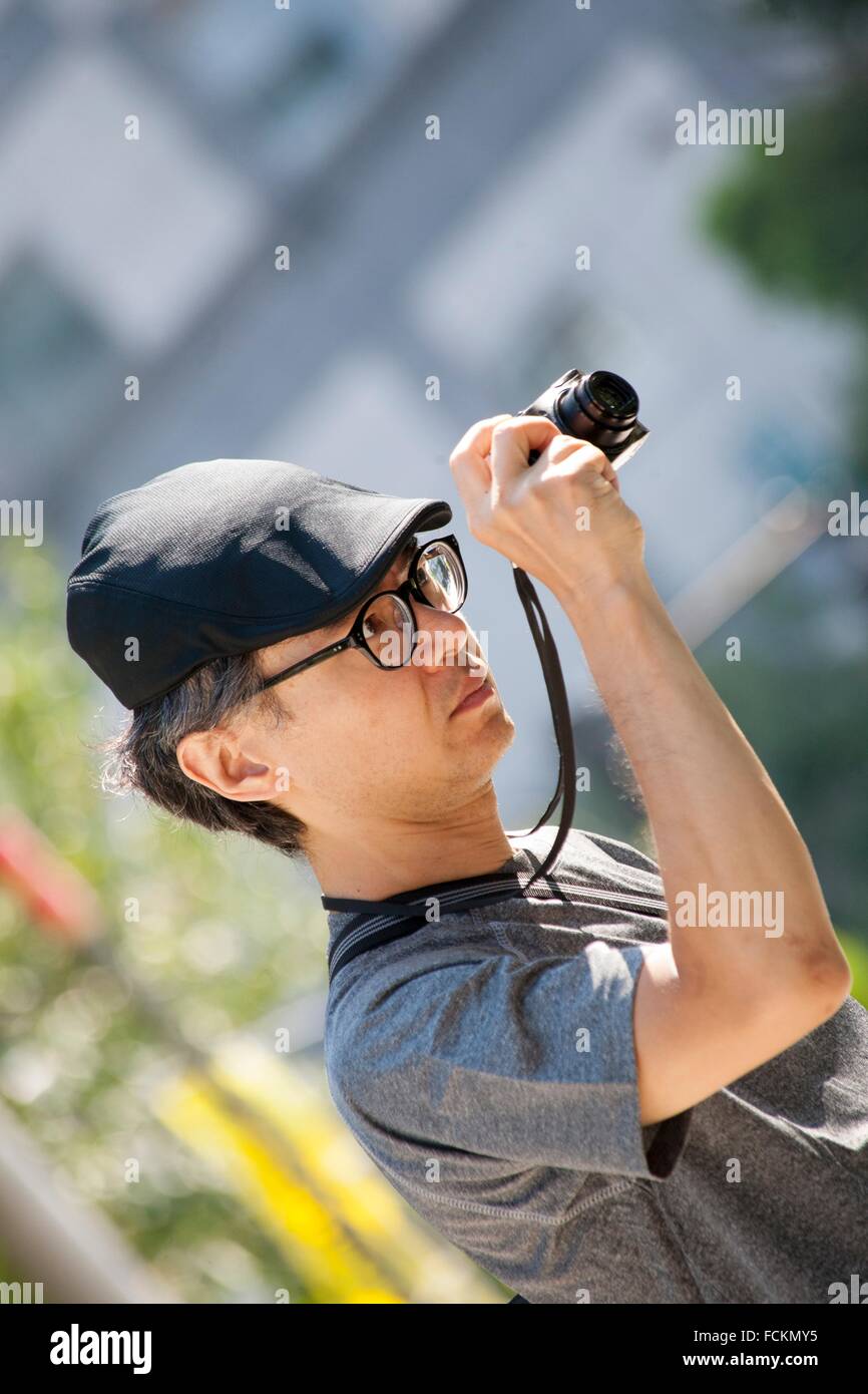 Man taking a picture Stock Photo - Alamy