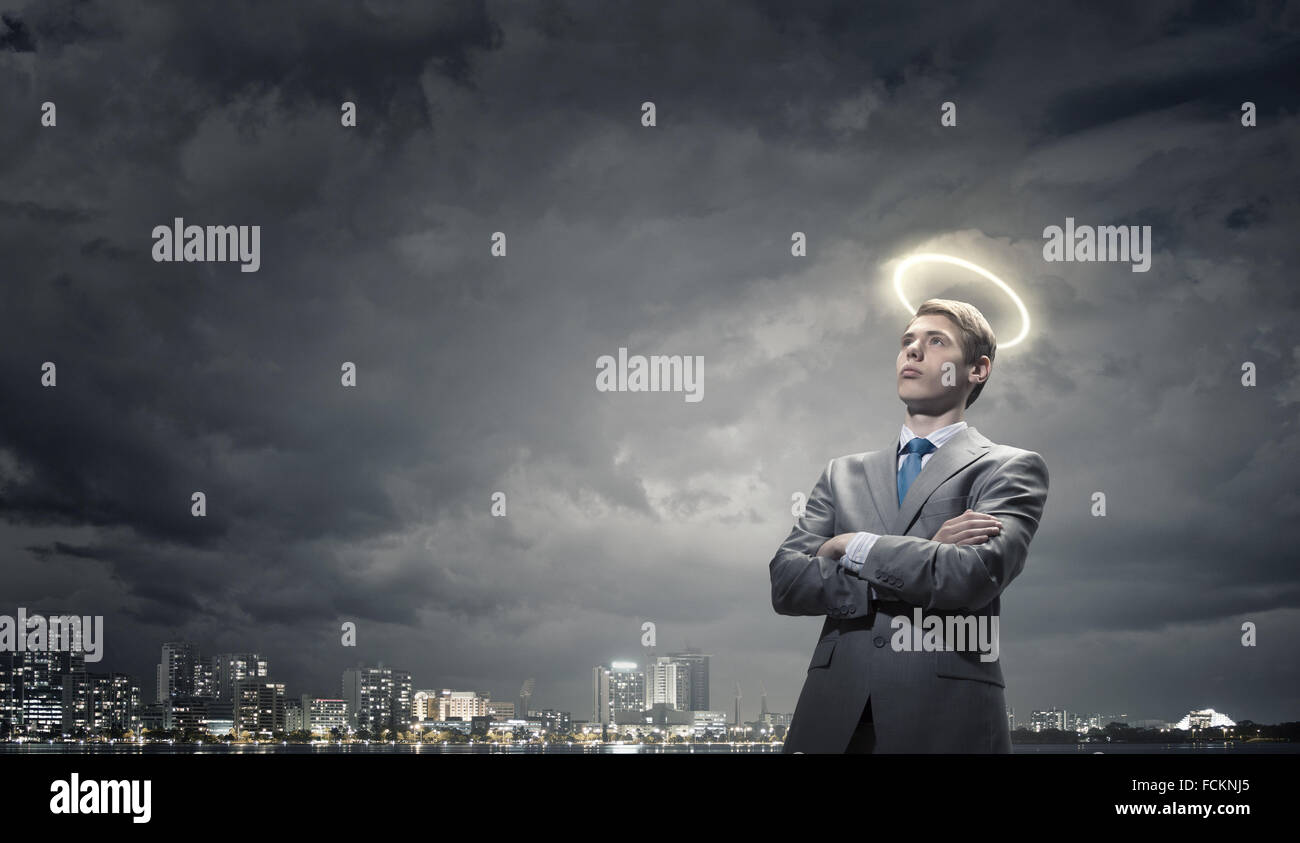 Young saint businessman with halo above head Stock Photo - Alamy