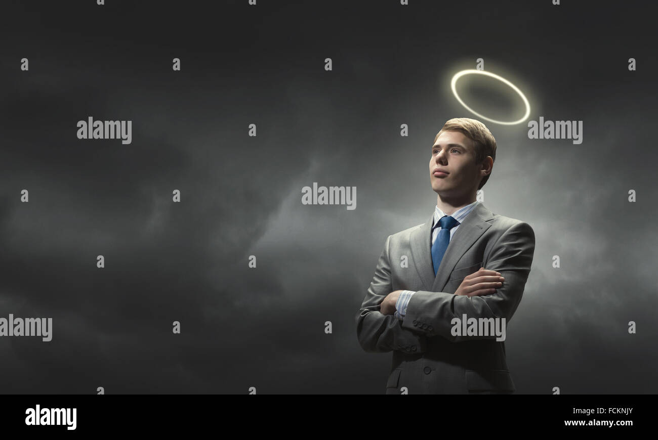 Young saint businessman with halo above head Stock Photo - Alamy