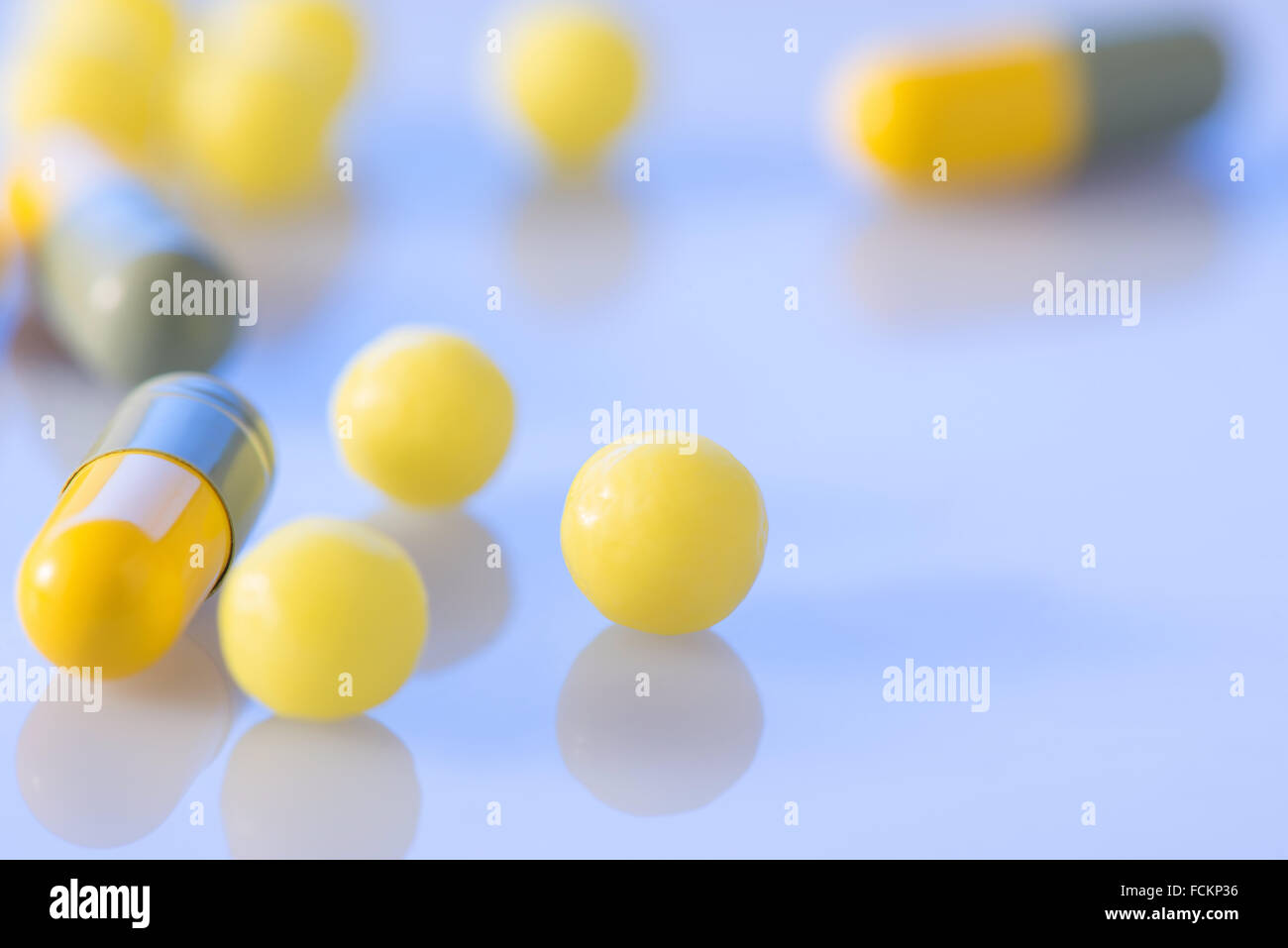 Coloured pills of different shape on the surface Stock Photo - Alamy