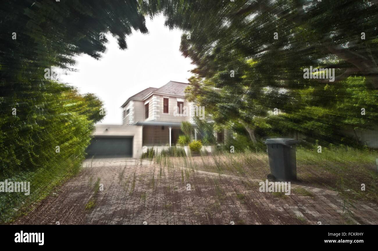Deserted House Empty No People A Refuse Bin Stands Forlornly In The deserted-house-empty-no-people-a-refuse-bin-stands-forlornly-in-the
