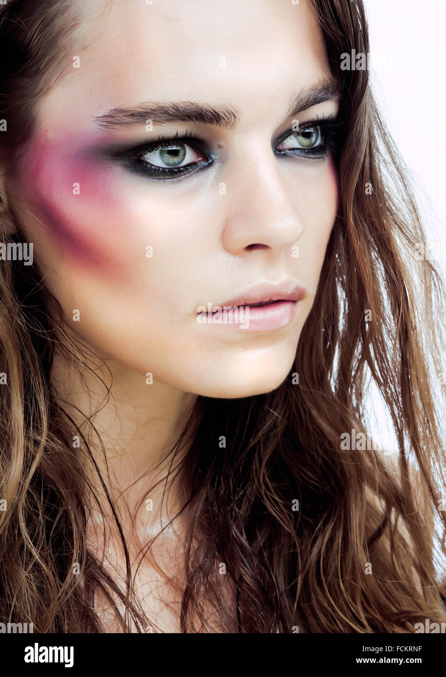 young beauty woman with makeup like shiner on face close up isolated ...