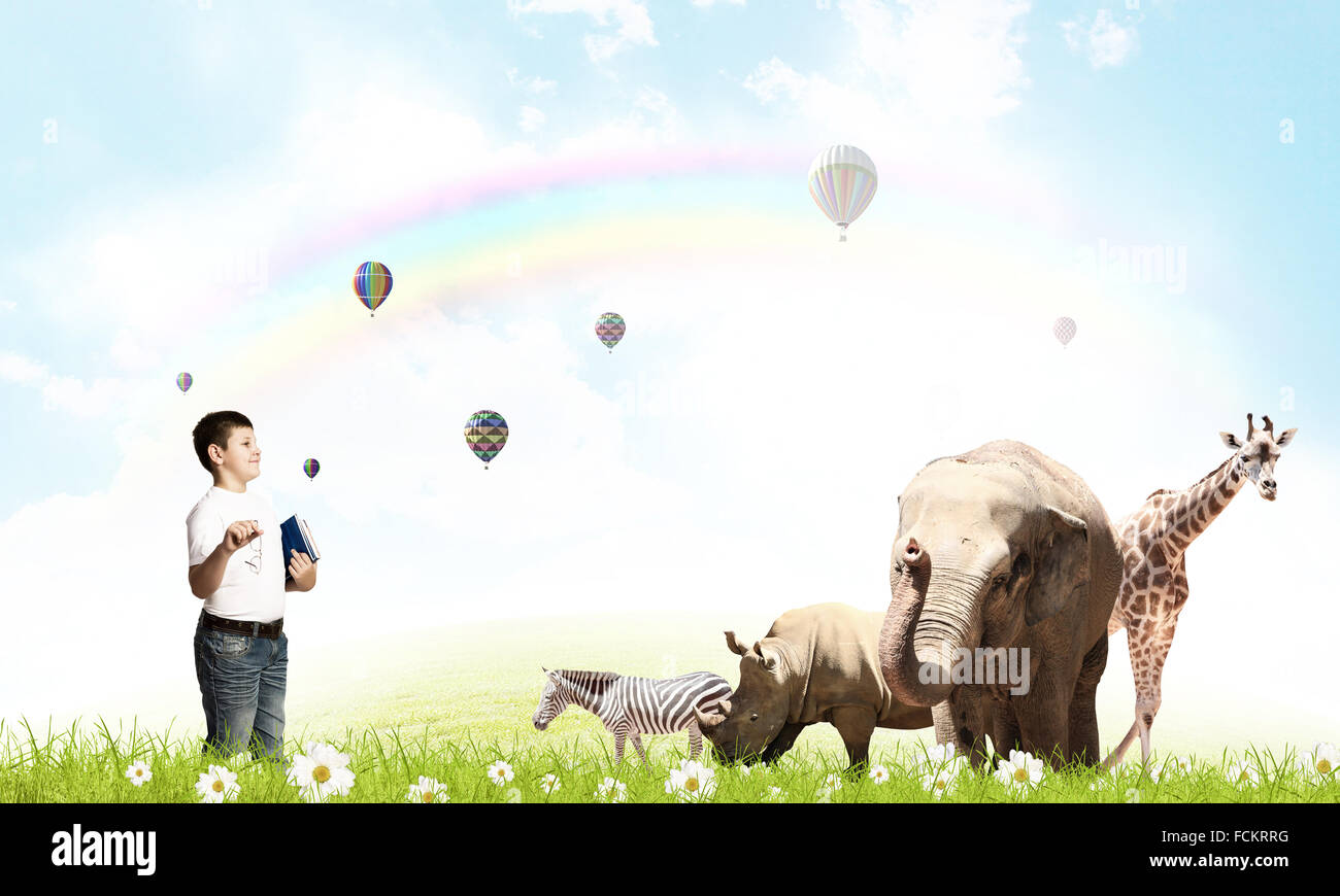 Boy of school age outdoor with wild animals Stock Photo - Alamy
