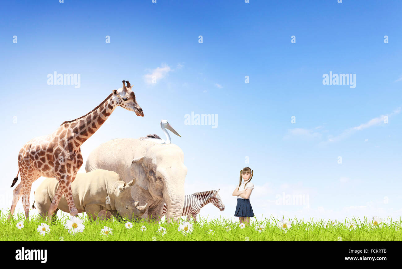 Cute school girl outdoor with wild animals Stock Photo - Alamy