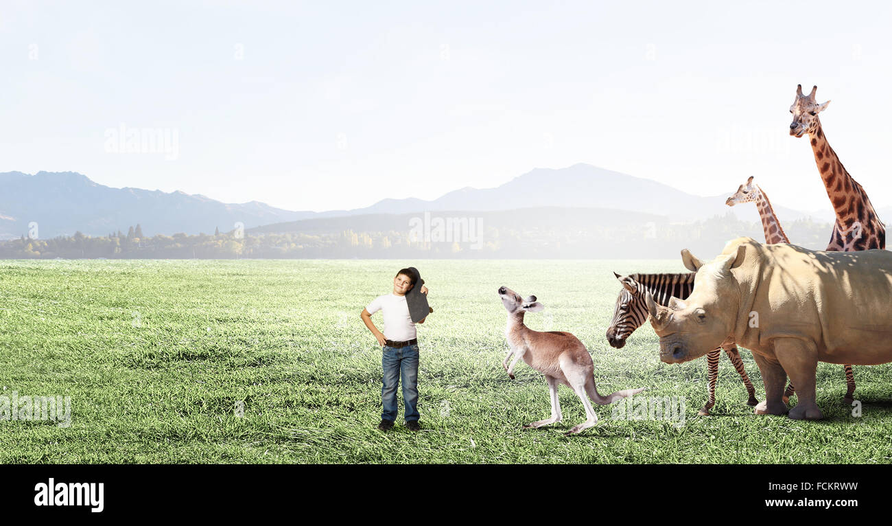 Boy of school age outdoor with wild animals Stock Photo - Alamy