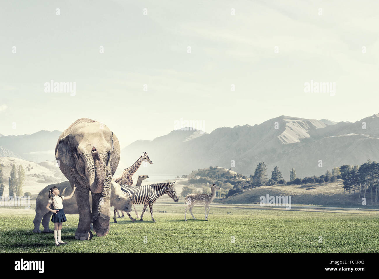 Cute school girl outdoor with wild animals Stock Photo - Alamy