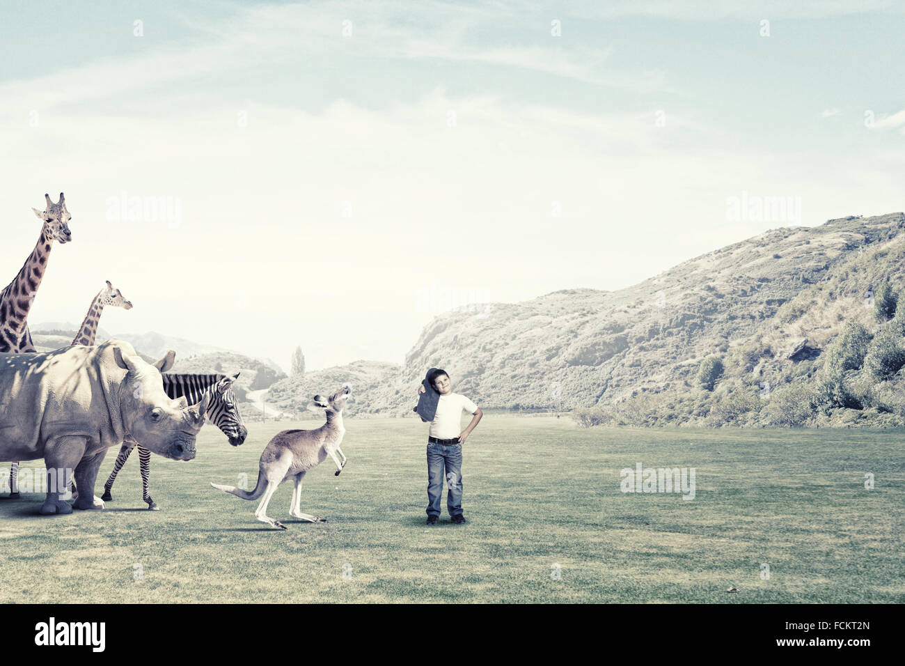 Boy of school age outdoor with wild animals Stock Photo - Alamy