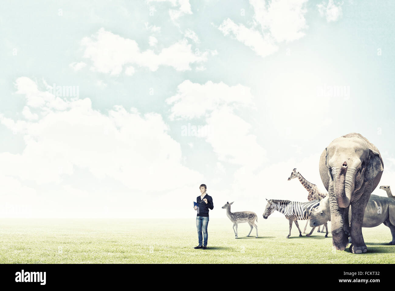 Boy of school age outdoor with wild animals Stock Photo - Alamy