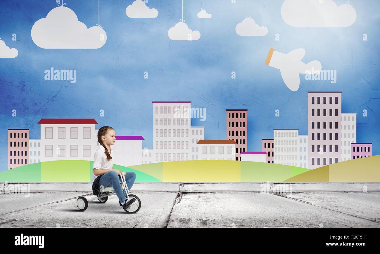 Happy cute girl riding tricycle hi-res stock photography and images - Alamy