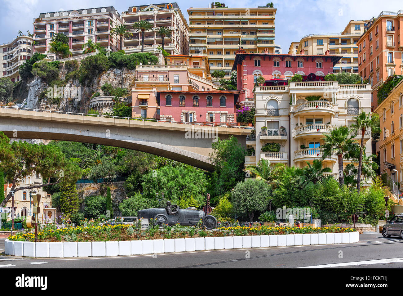 Colorful buildings and sculpture of William Grover-Williams in Bugatti ...